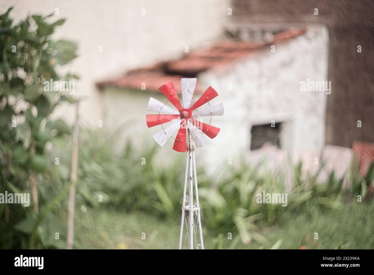 small red and silver windmill Stock Photo - Alamy