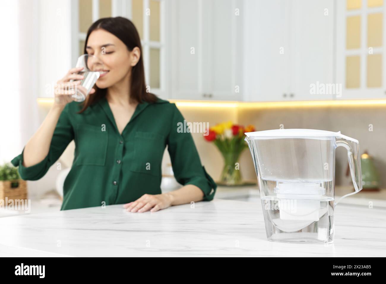 Woman drinking water filter hi-res stock photography and images - Alamy