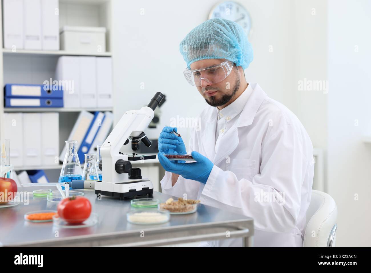 Quality control. Food inspector checking safety of products in ...