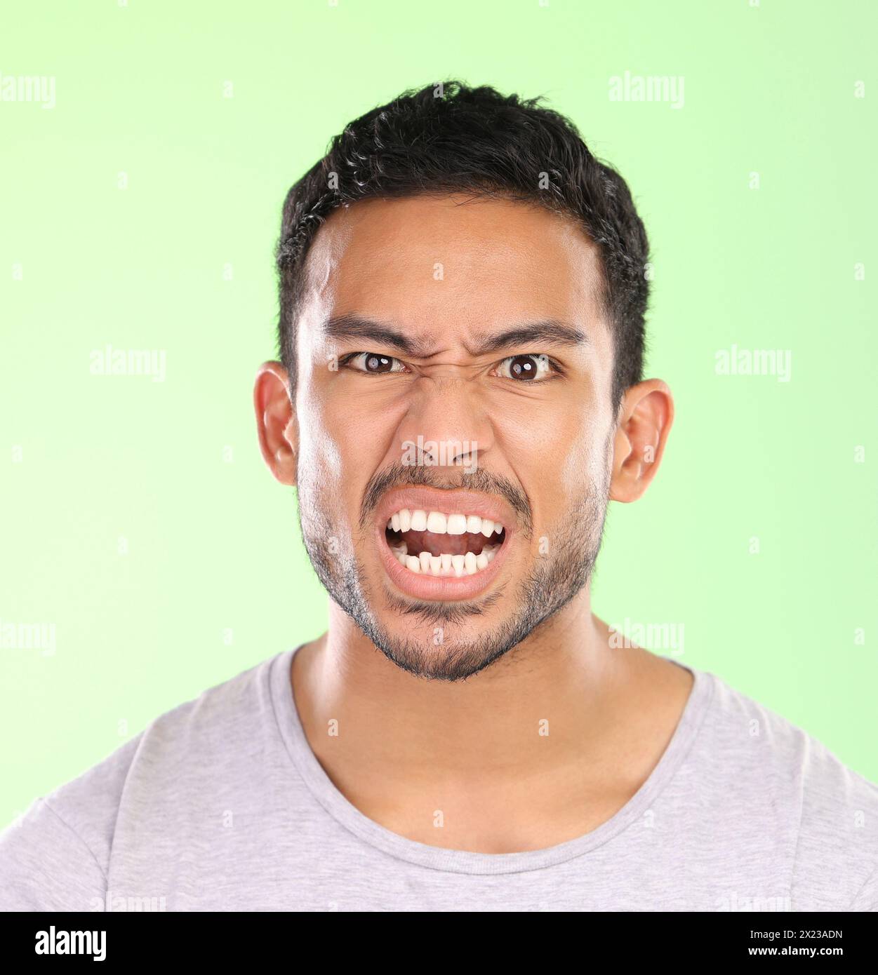 Angry man, portrait and face with emotion for frustration, moody or ...