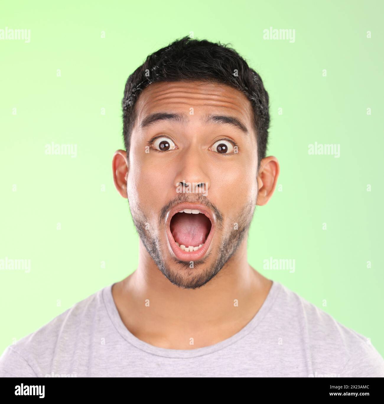 Excited, shock and portrait of man in studio with amazing news, happy ...