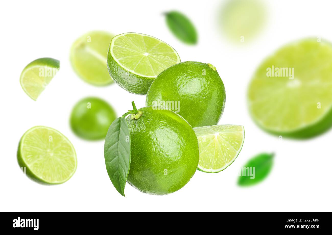 Fresh ripe limes in air on white background Stock Photo - Alamy