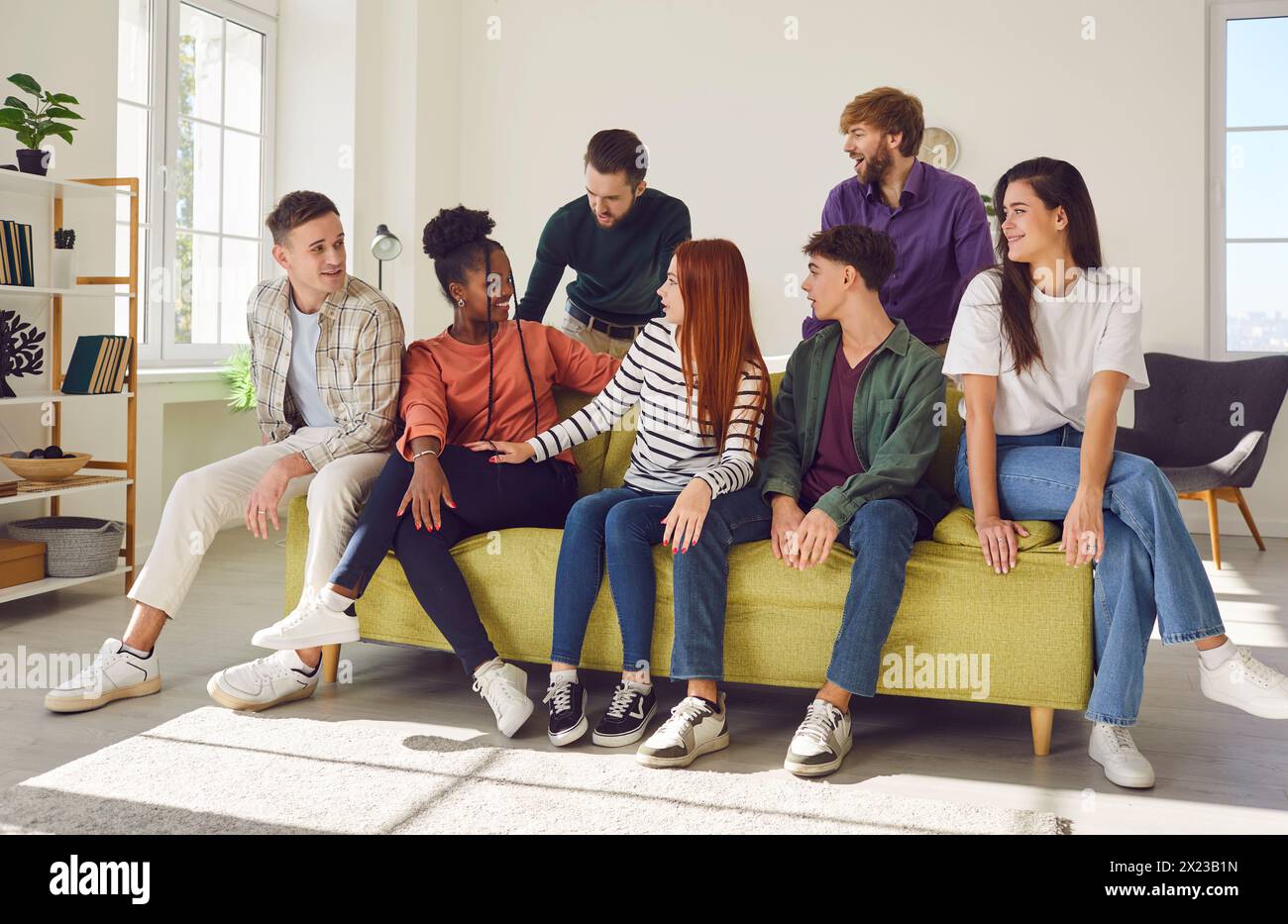 Young people diverse group portrait, happy friends sitting on sofa ...