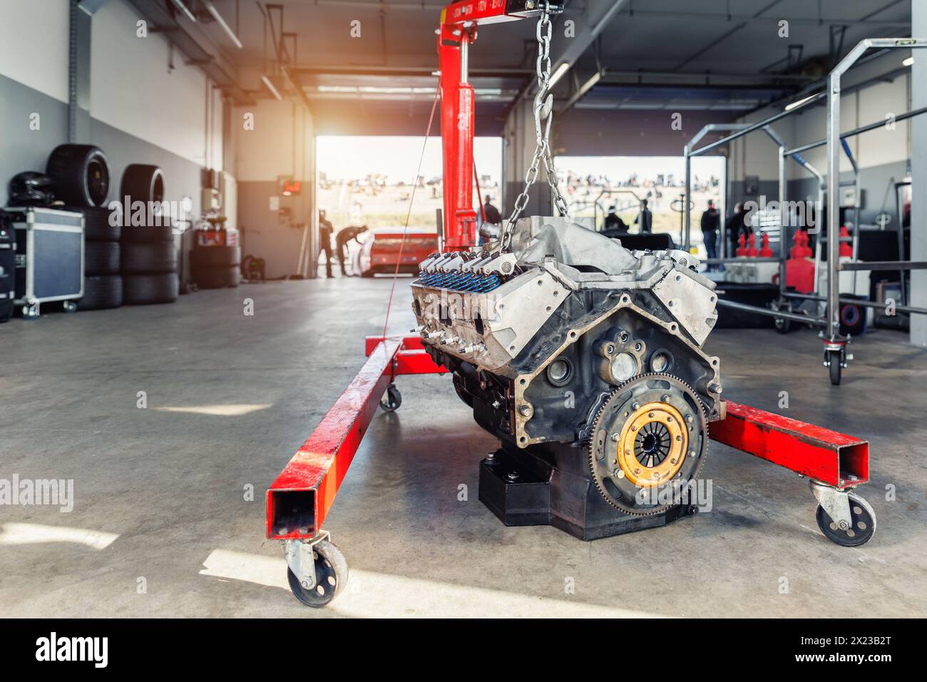 Motorsport pit lane garage box paddock hanged v8 engine suspended crane ...
