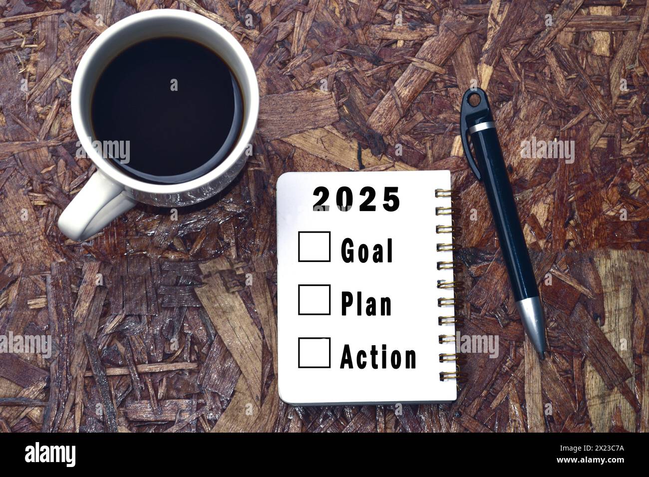 2025 new year goal,plan,action concepts on notepad on wooden desk Stock ...