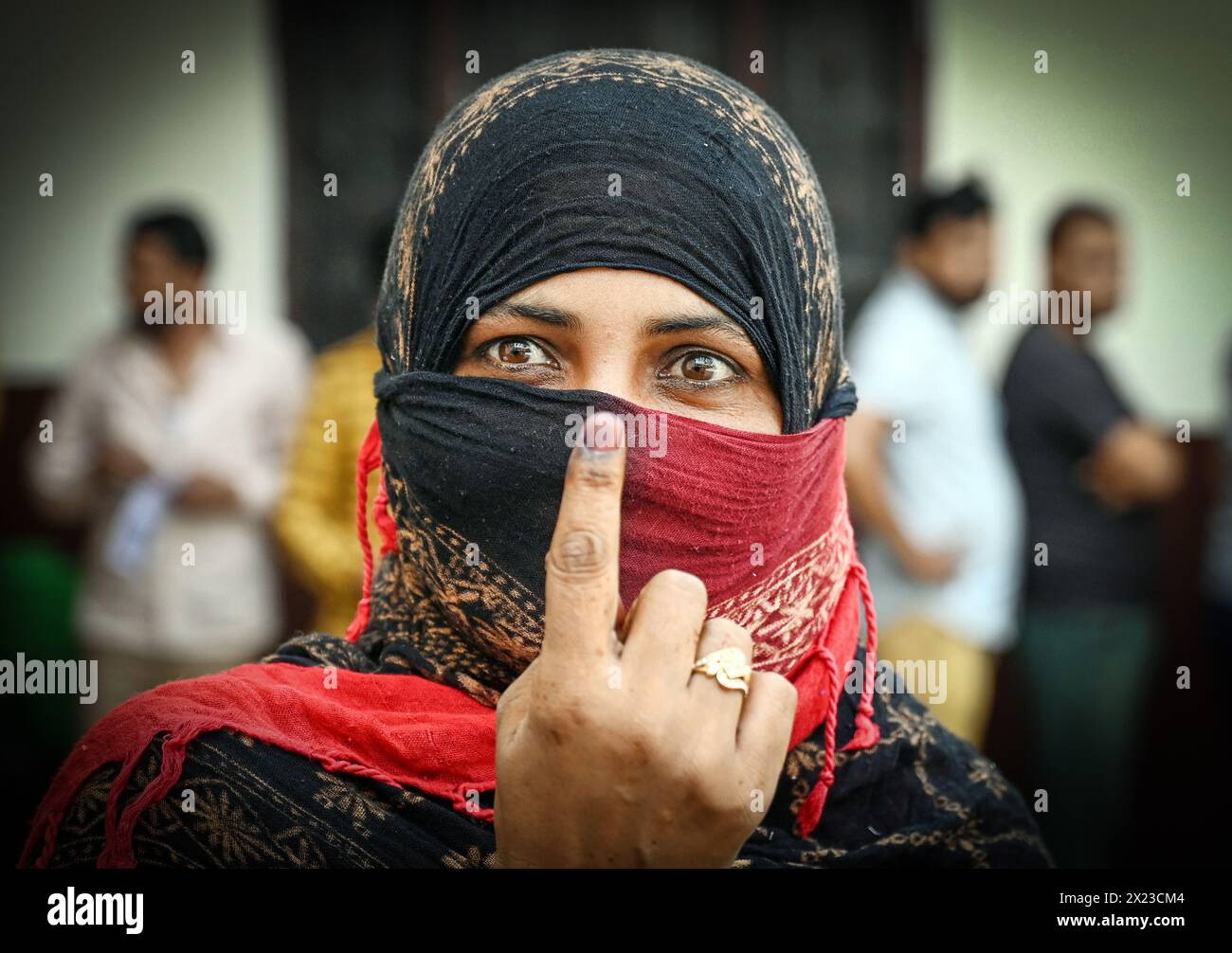 MUZAFFARNAGAR, INDIA - APRIL 19: A woman shows off her inked finger ...