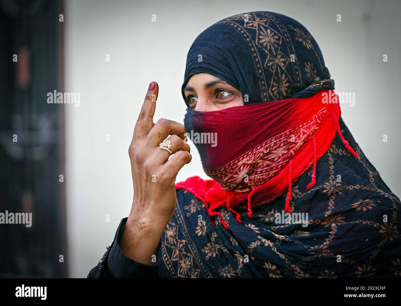 MUZAFFARNAGAR, INDIA - APRIL 19: A woman shows off her inked finger ...