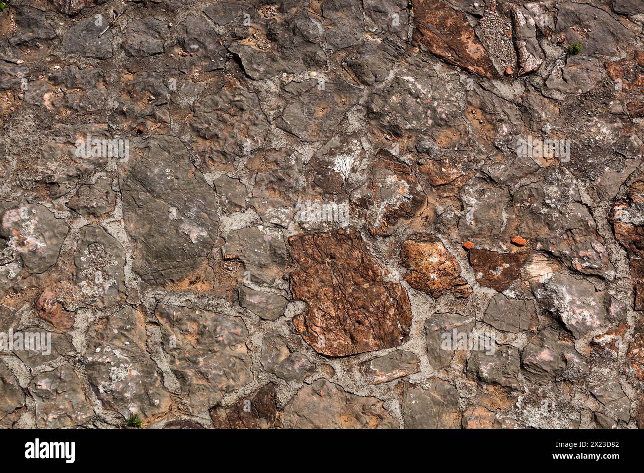 Stone texture of a wall in Montenegro. An ancient wall made of brown ...