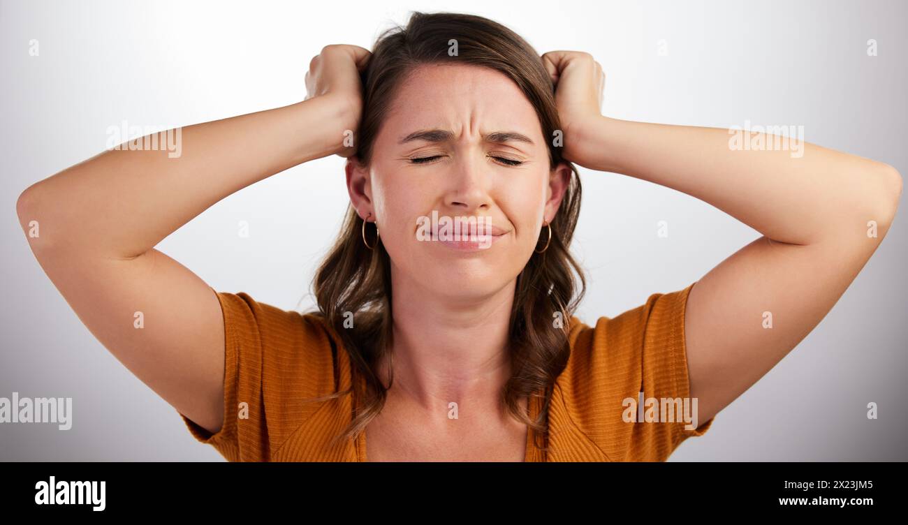 Depression, headache and sad woman in studio with stress, fail or ...