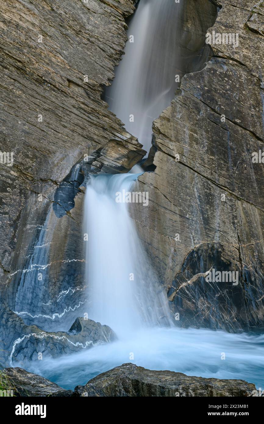 Waterfall flows through rocky gorge, Plaun Segnas Sut, Lower ...