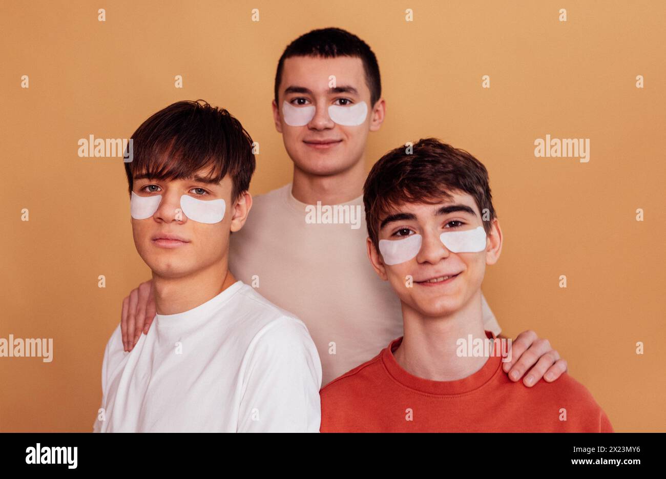A close-up portrait of teenagers with moisturizing patches under their ...