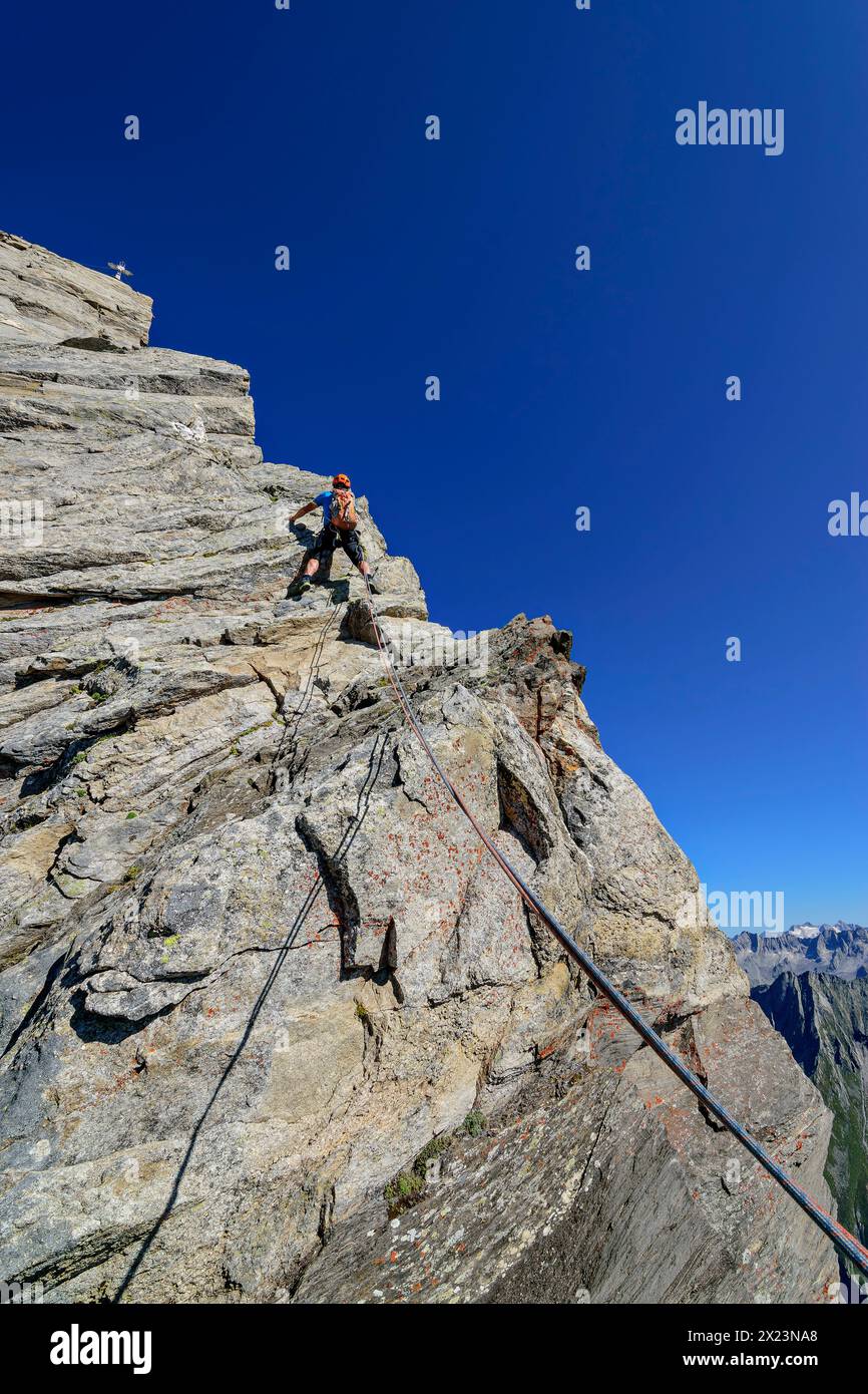 Man climbing through rock face on Zsigmondyspitze, Zsigmondyspitze ...