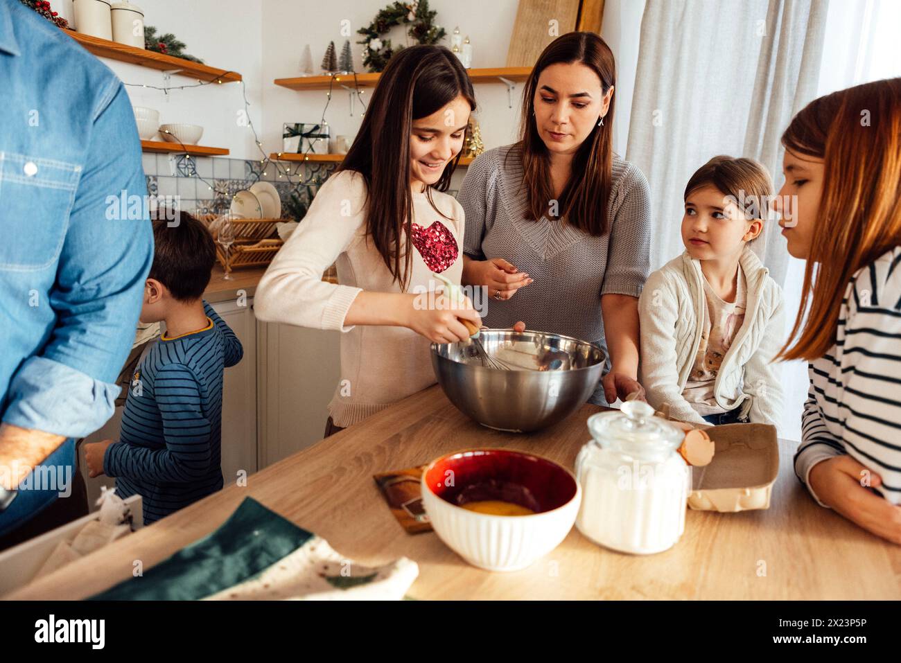 Cooking a festive dinner with the whole family in the kitchen. A ...