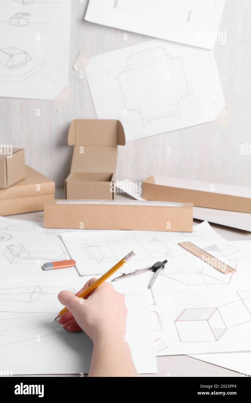 Woman creating packaging design hi-res stock photography and images - Alamy