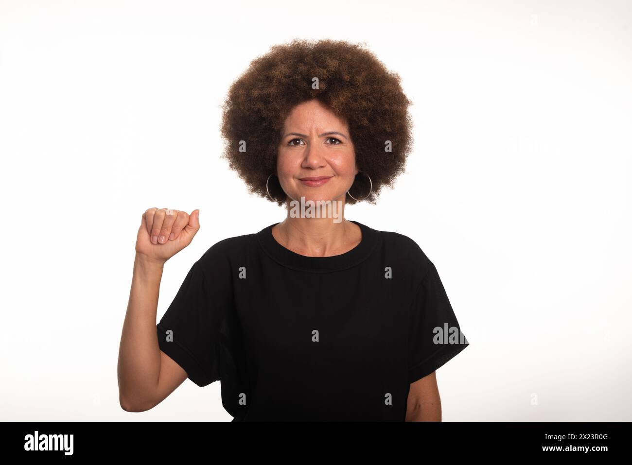 Interpreter of the Brazilian sign language, Libras, making the letter A ...