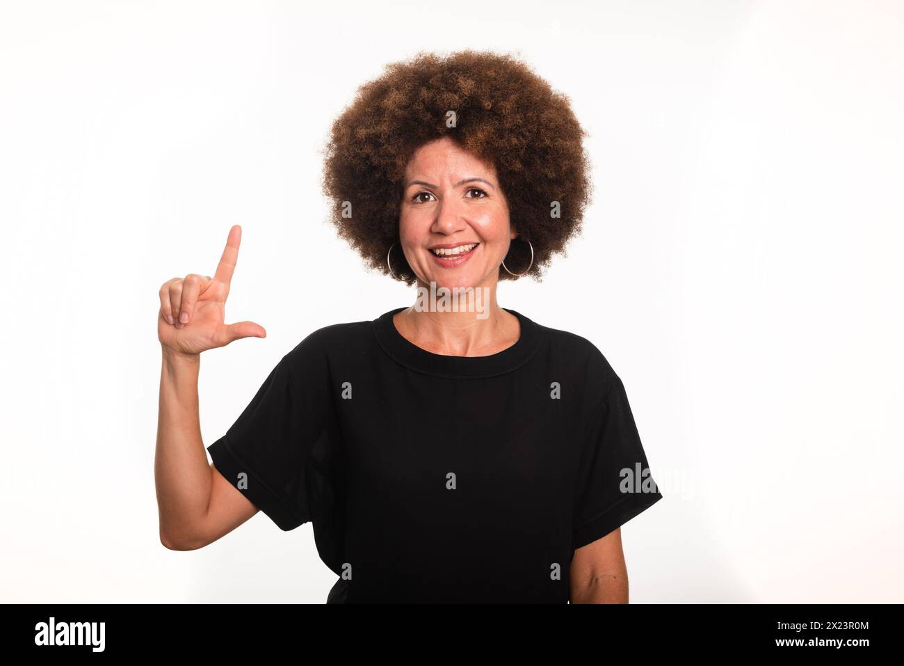 Female interpreter of the Brazilian sign language, Libras, making the ...