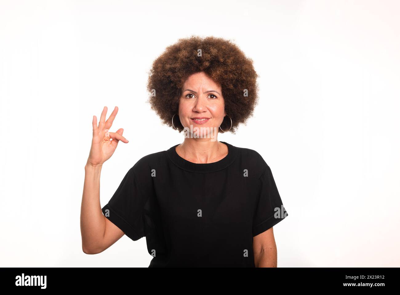 Female interpreter of the Brazilian sign language, Libras, making the ...