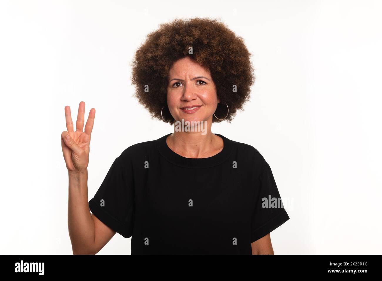 Female interpreter of the Brazilian sign language, Libras, making the ...