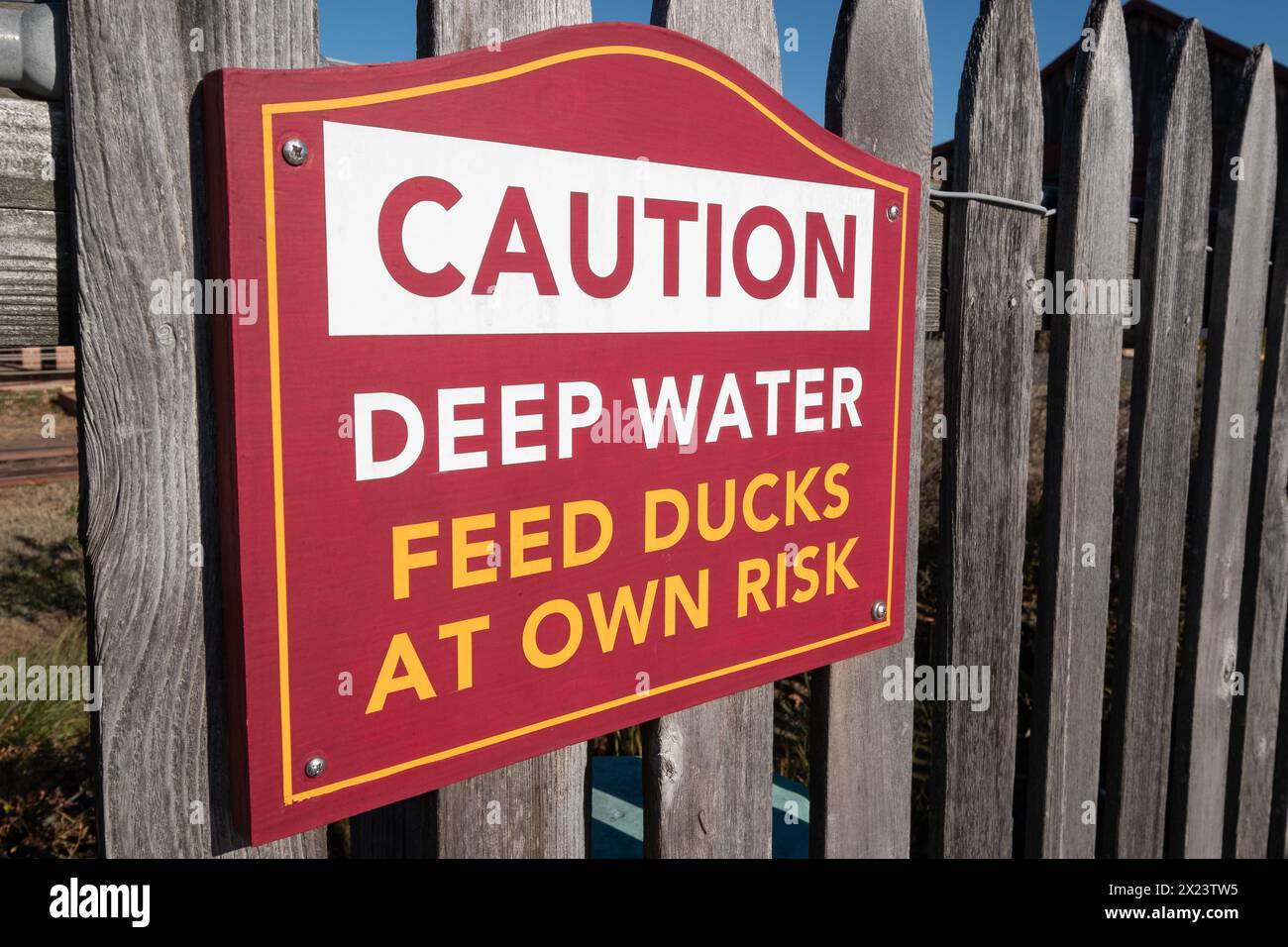 Warning sign on picket fence in St Michaels, MD Stock Photo - Alamy