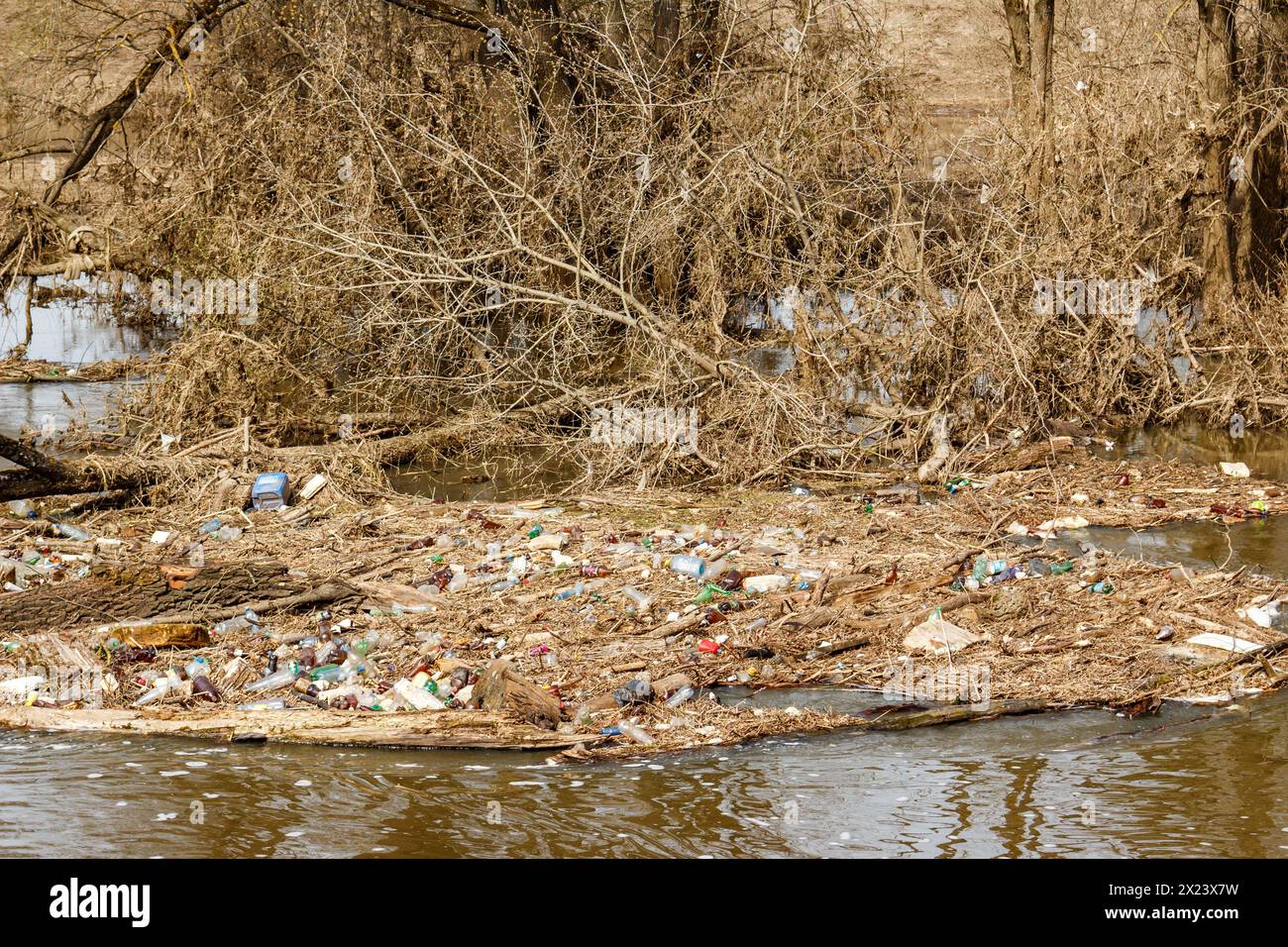 Congestion of accumulated garbage on the river, plastic pollution Stock ...