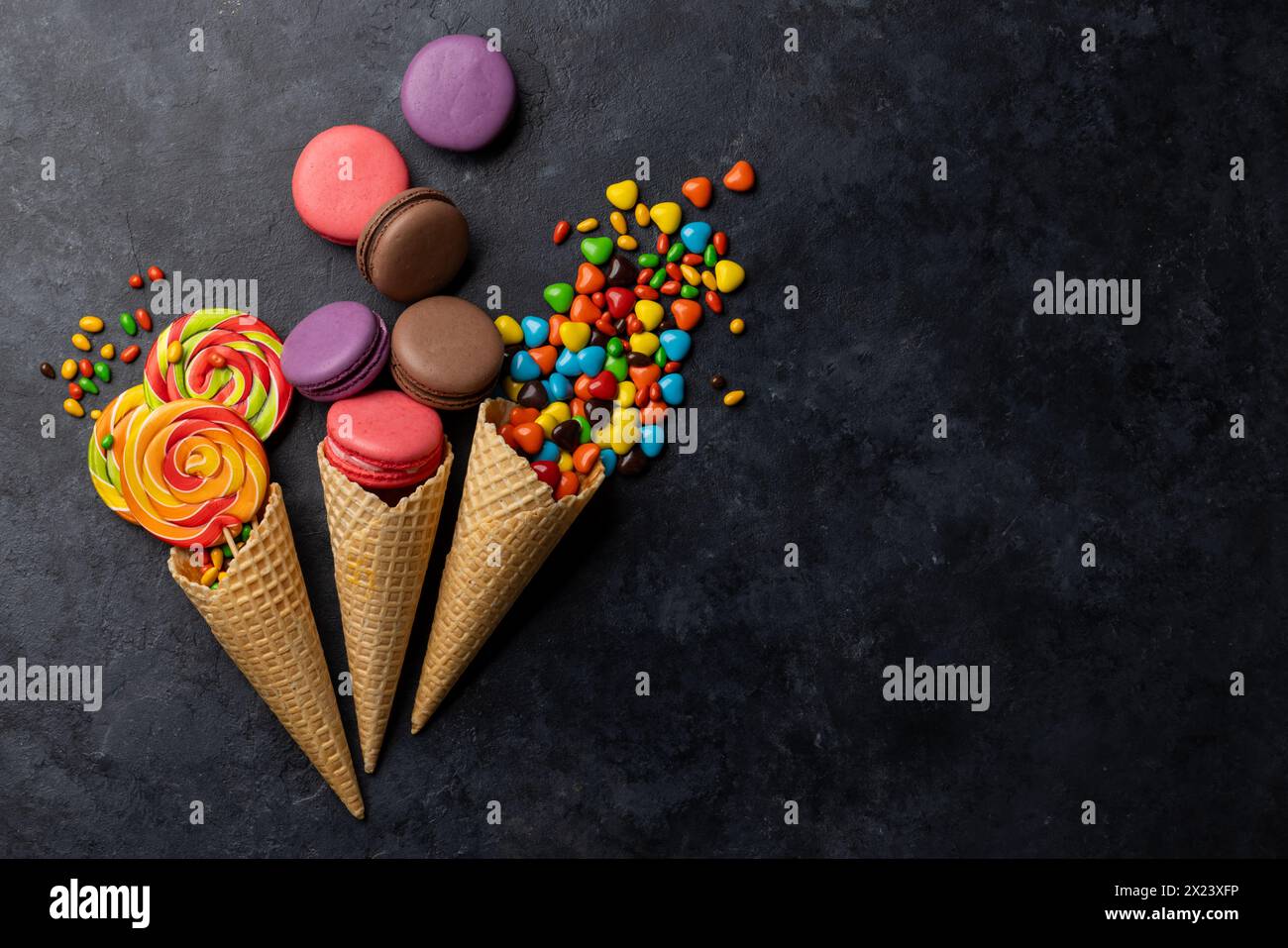 Various colorful candies, lollipops, and macaroons. Flat lay sweets ...