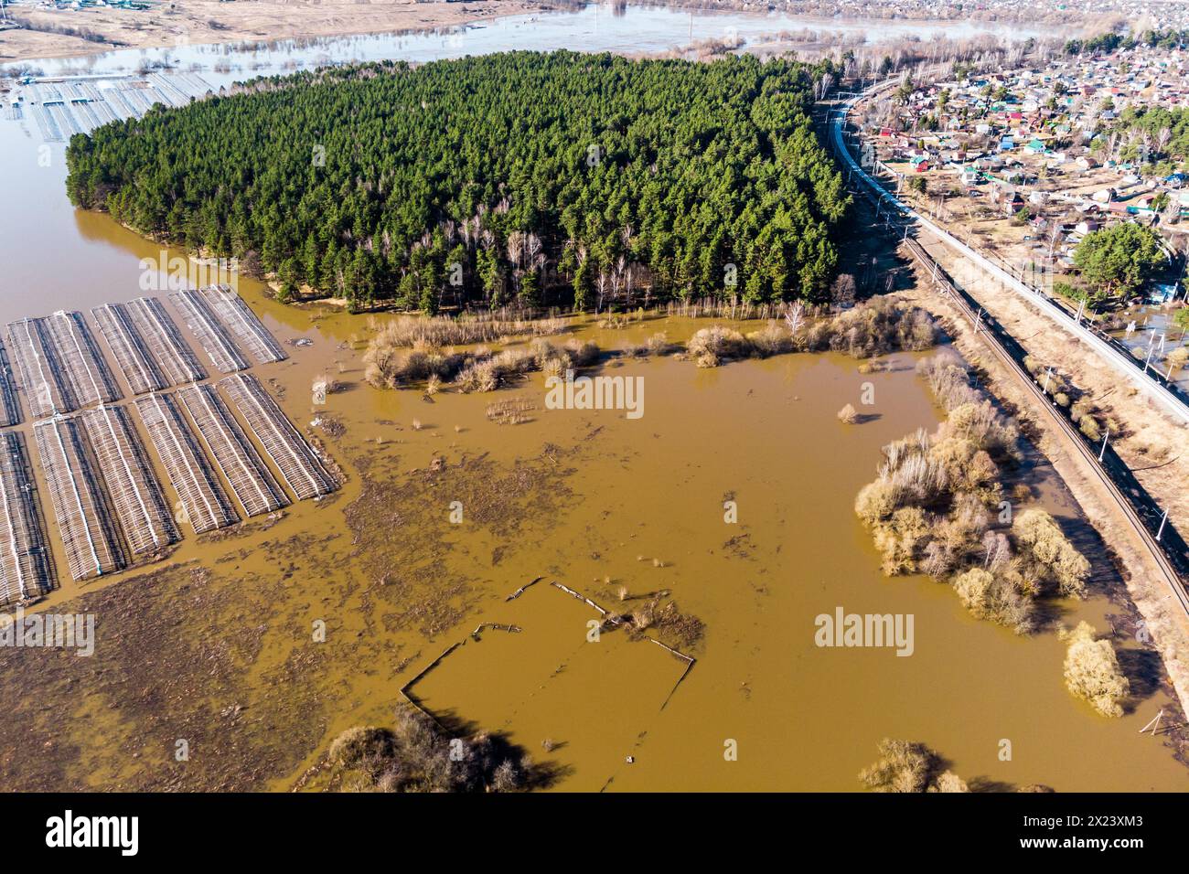 A river spill in a rural area from the air, large areas of land flooded ...