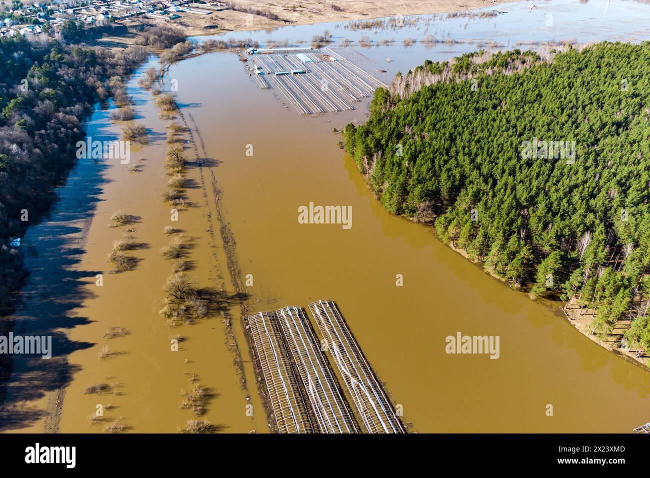 A river spill in a rural area from the air, large areas of land flooded ...