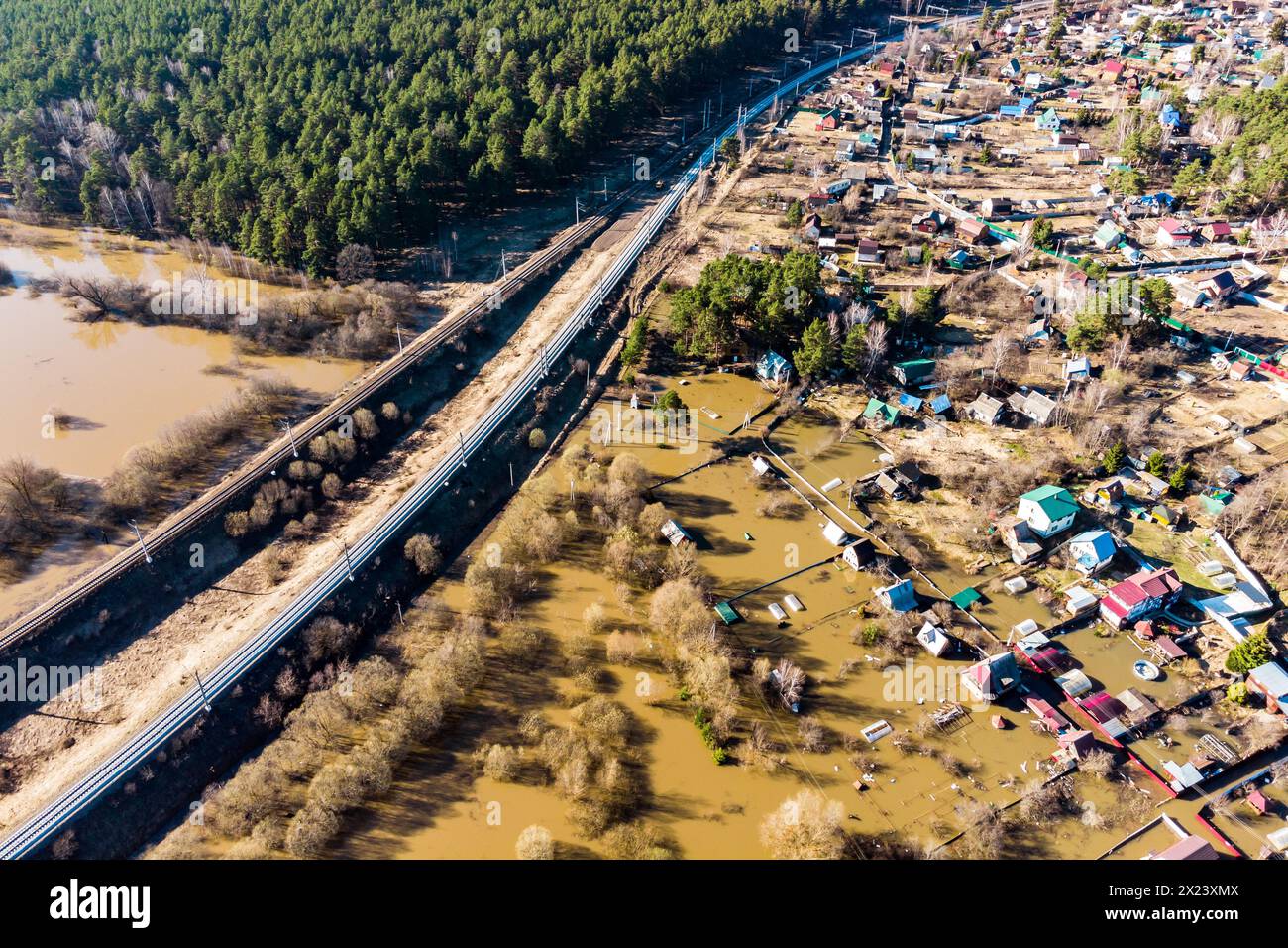 Landscape with a view of a strong river flood reaching residential ...