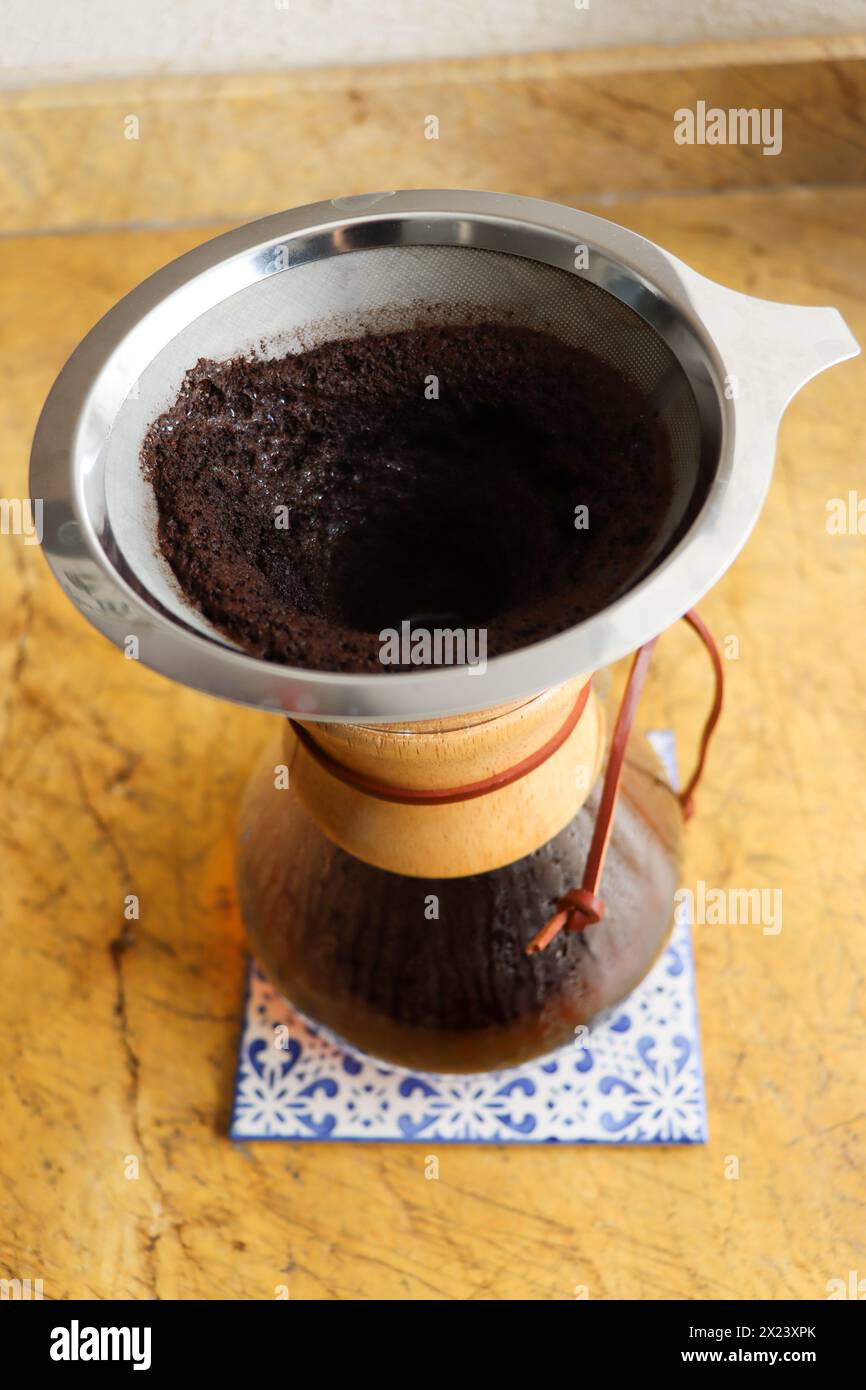 Glass pour over coffee maker on ceramic tile. Vertical shot, complete ...