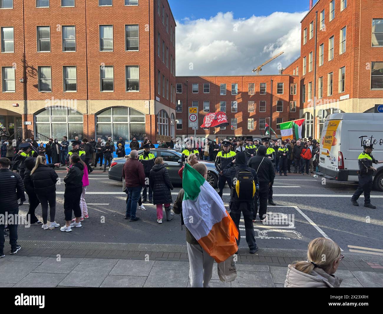 Opposing groups of demonstrators gather at a protest over a migrant ...