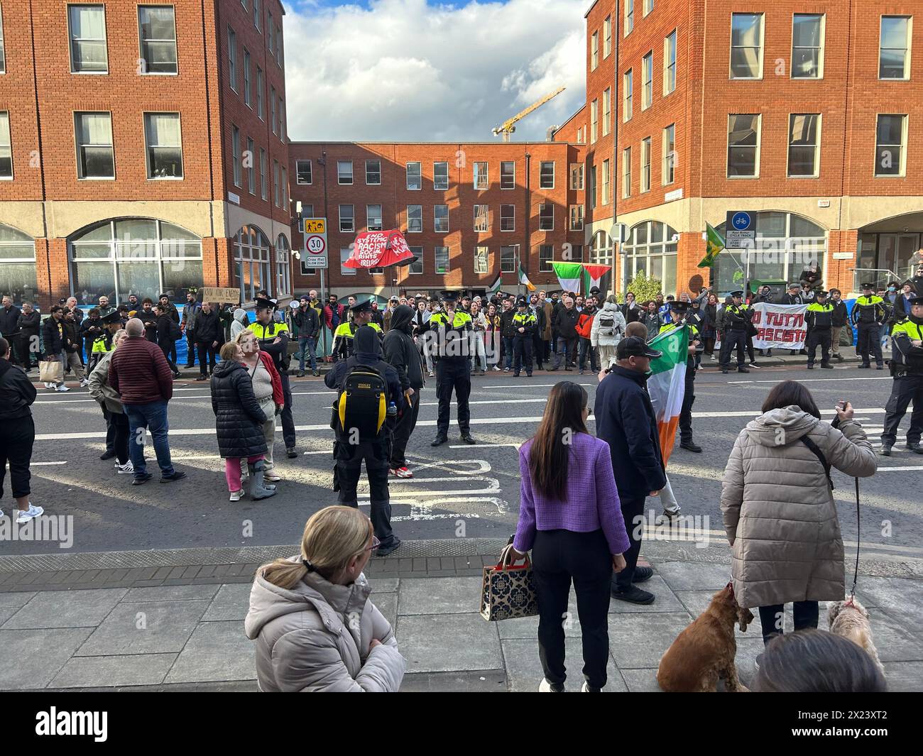 Opposing groups of demonstrators gather at a protest over a migrant ...
