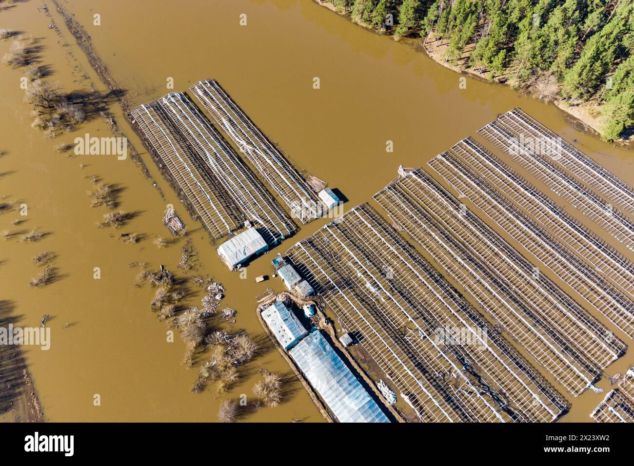 Agricultural farm fields with greenhouses flooded during a strong ...