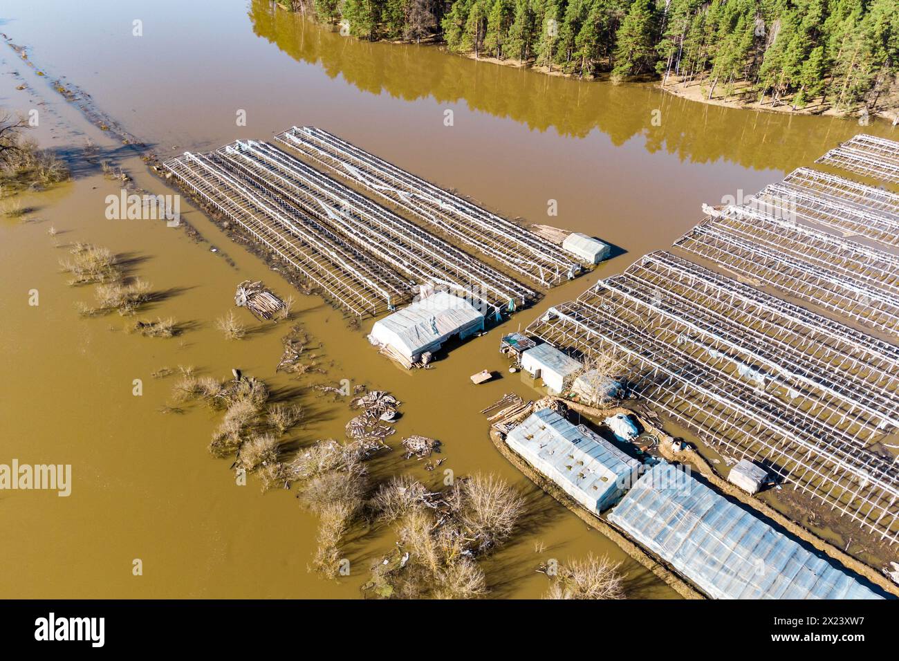 Agricultural farm fields with greenhouses flooded during a strong ...