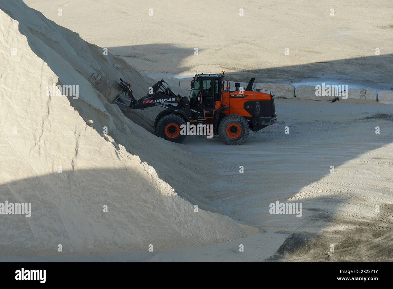 Powerful Doosan wheel loader for heavy duty work moving piles of gravel ...