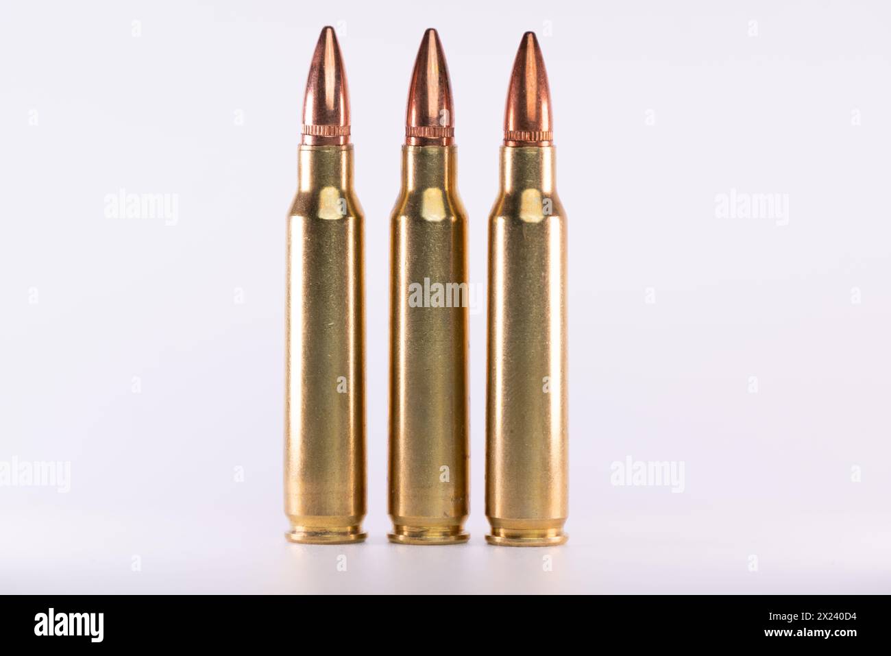 three Shiny hunting rifle bullets Stock Photo - Alamy