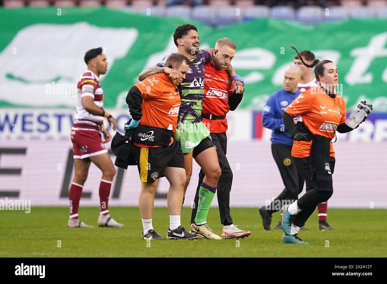 Castleford Tigers' Charbel Tasipale (centre) is carried off the field ...