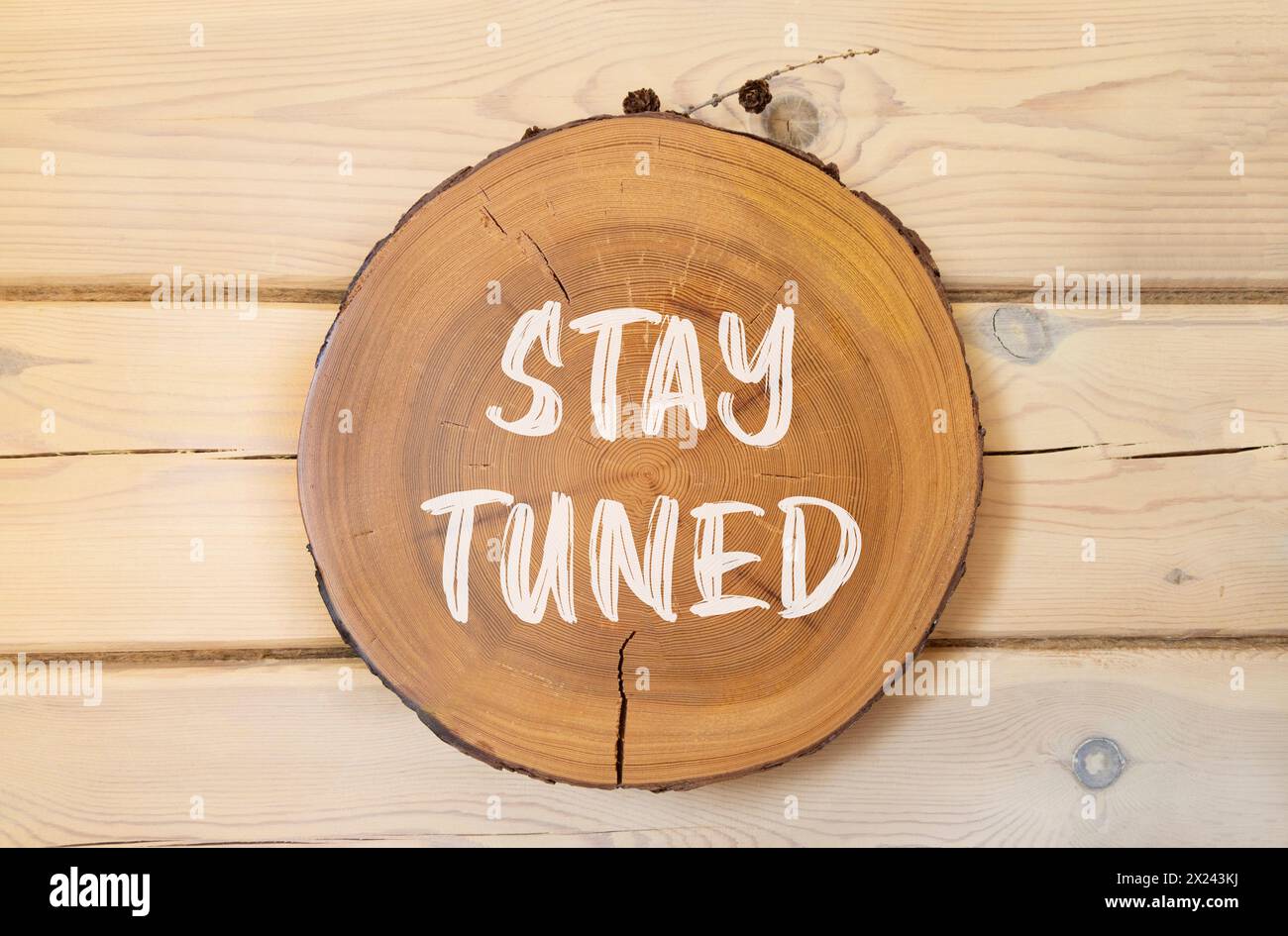 Stay tuned symbol. Concept words Stay tuned on beautiful wooden circle ...
