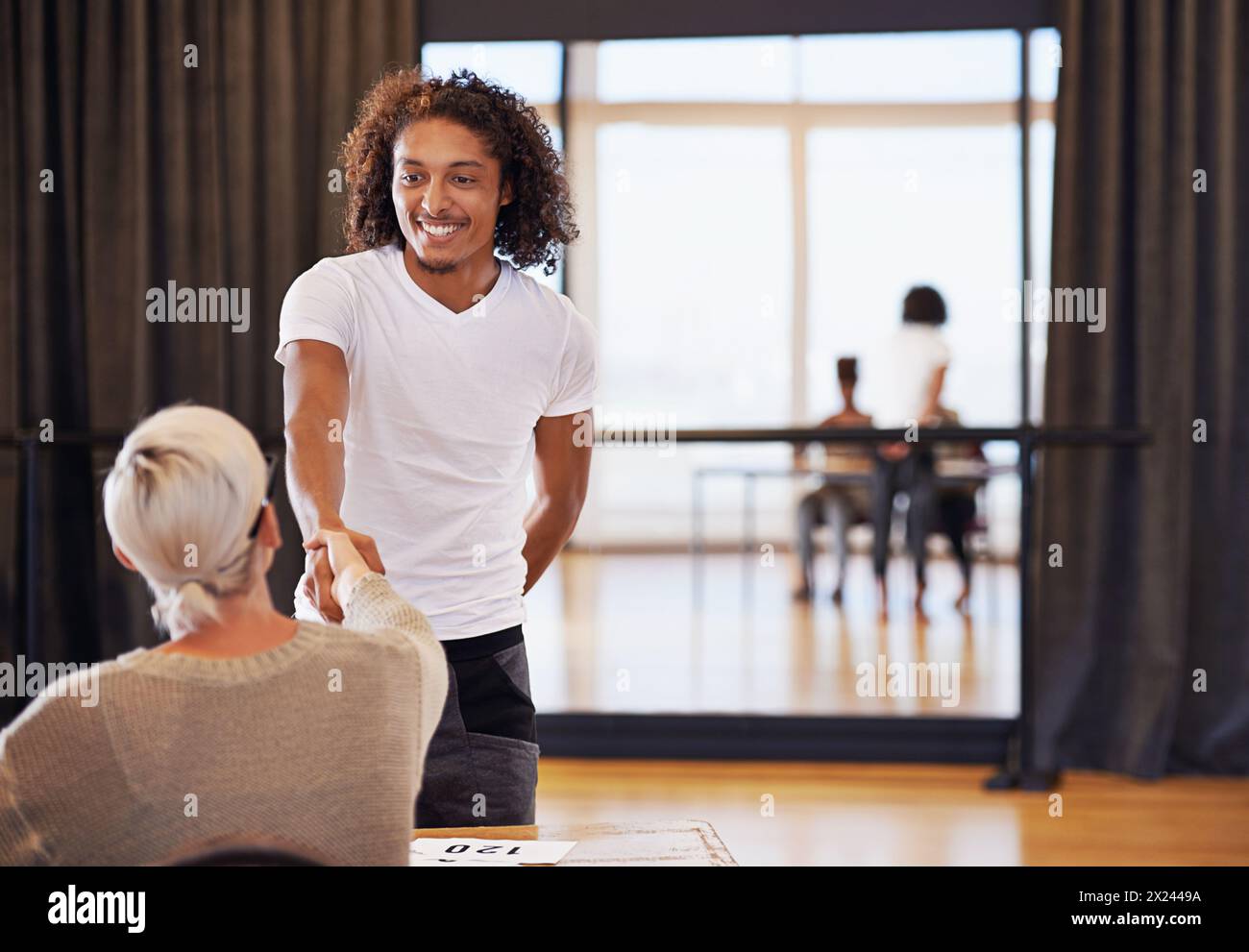 Man, dancer and happy in audition for competition with handshake for ...