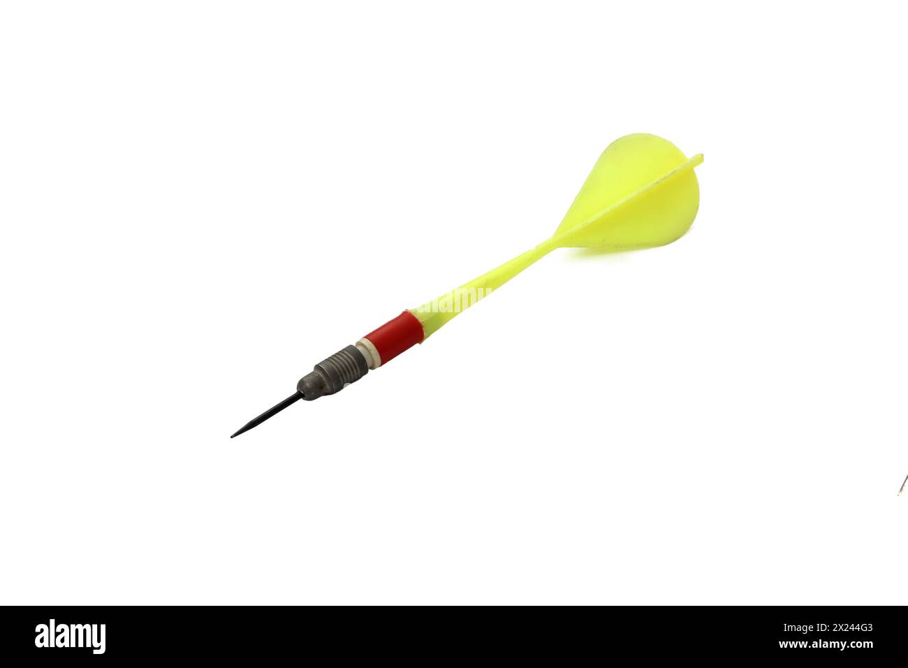 Yellow dart stuck with plastic feathers isolated on white background ...