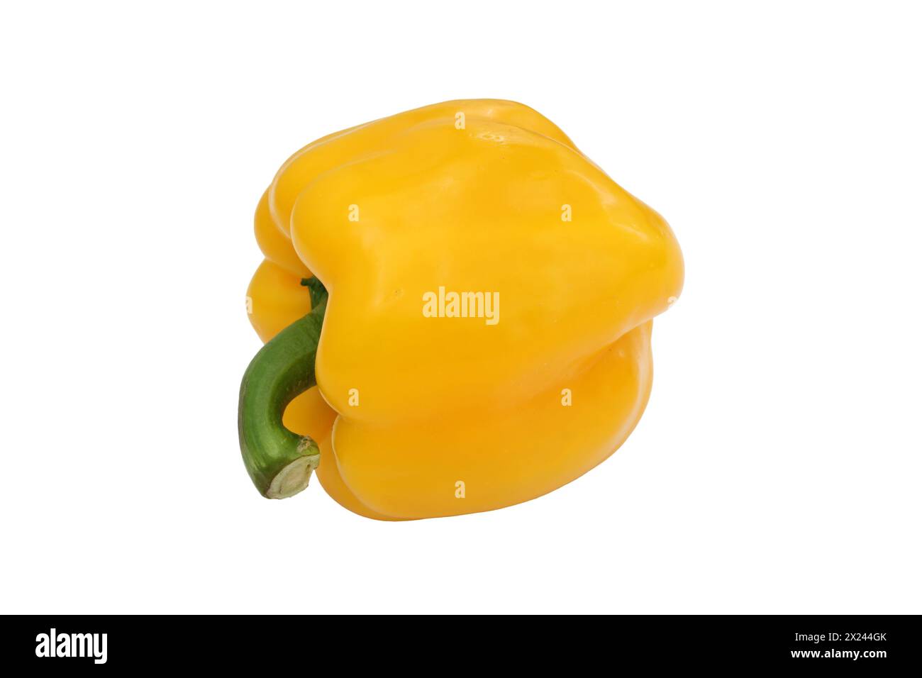 Yellow bell pepper, a staple food ingredient, on white background Stock ...