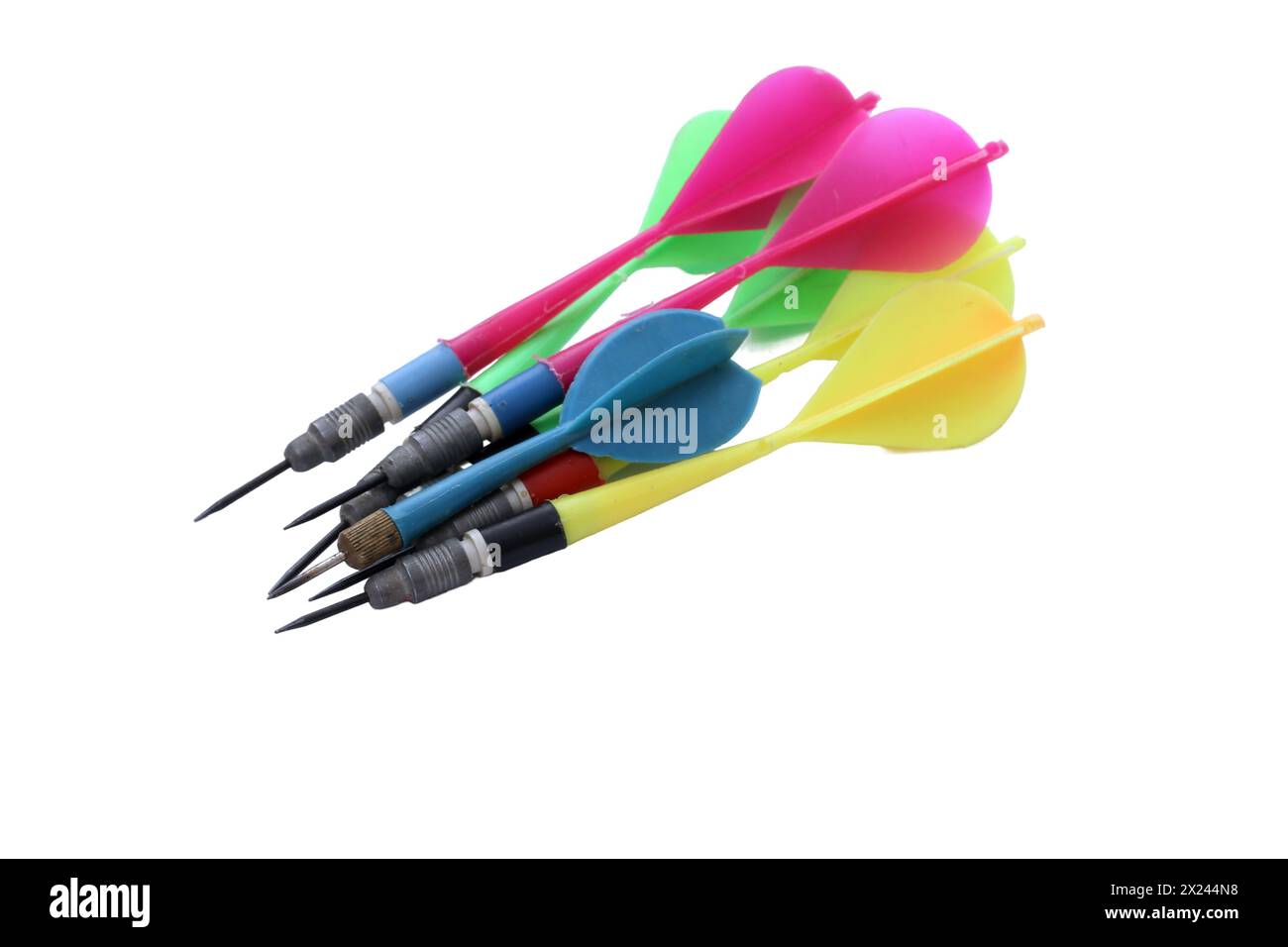 Colorful darts stuck with plastic feathers isolated on white background ...