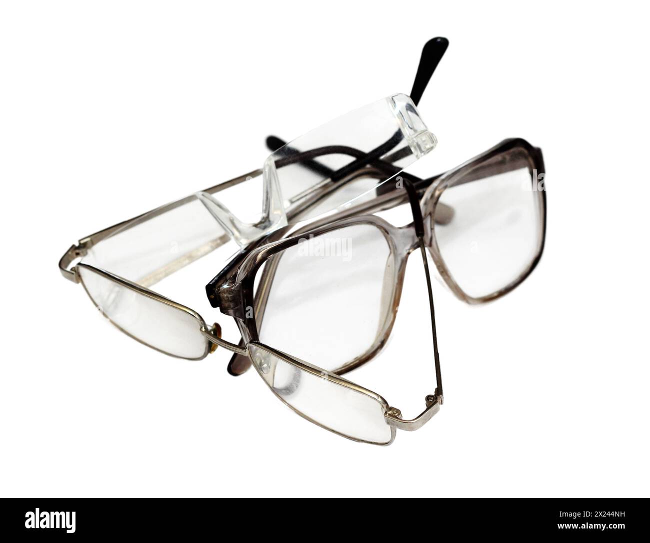 Three different glasses lie on top of each other isolated on white ...