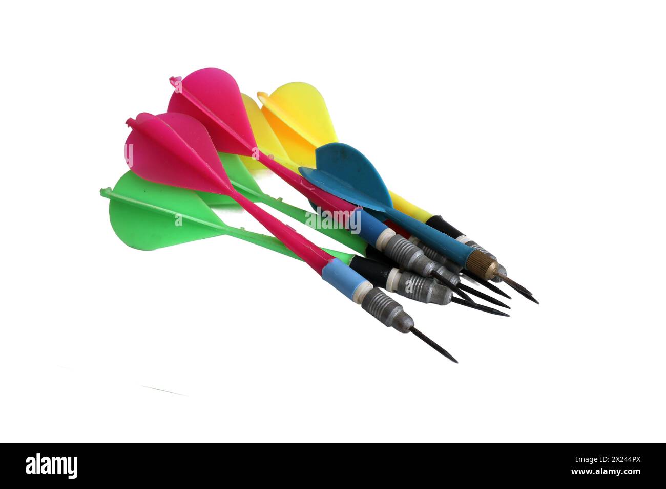 Colorful darts stuck with plastic feathers isolated on white background ... Colorful darts stuck with plastic feathers isolated on white background ...