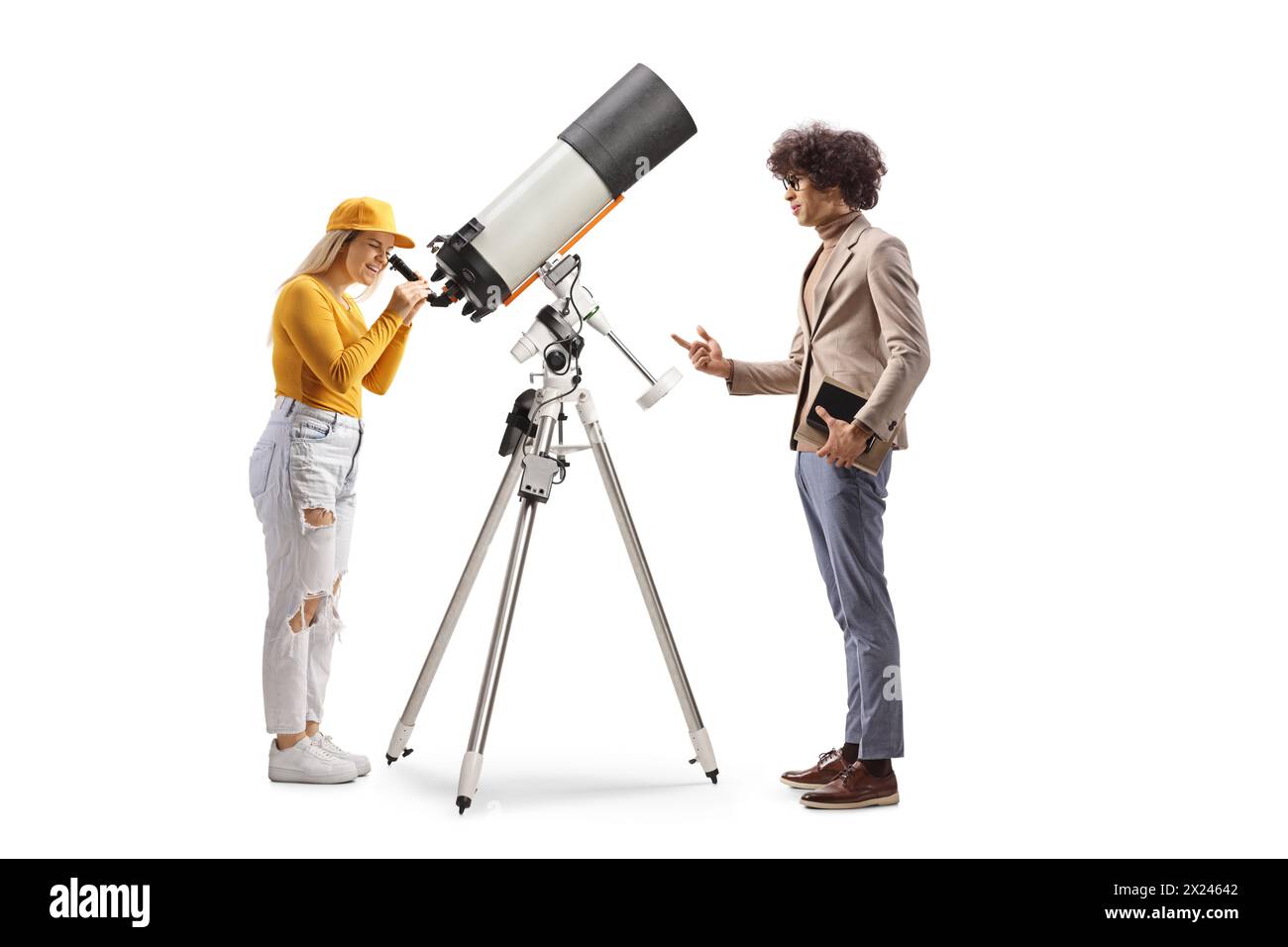 Man talking to a young female observing the planets and stars with a ...