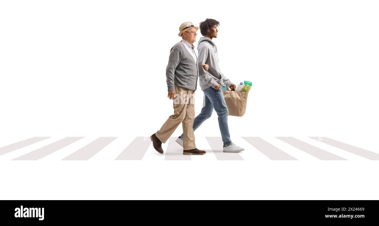 Young african american man helping an old man with grocery bags ...