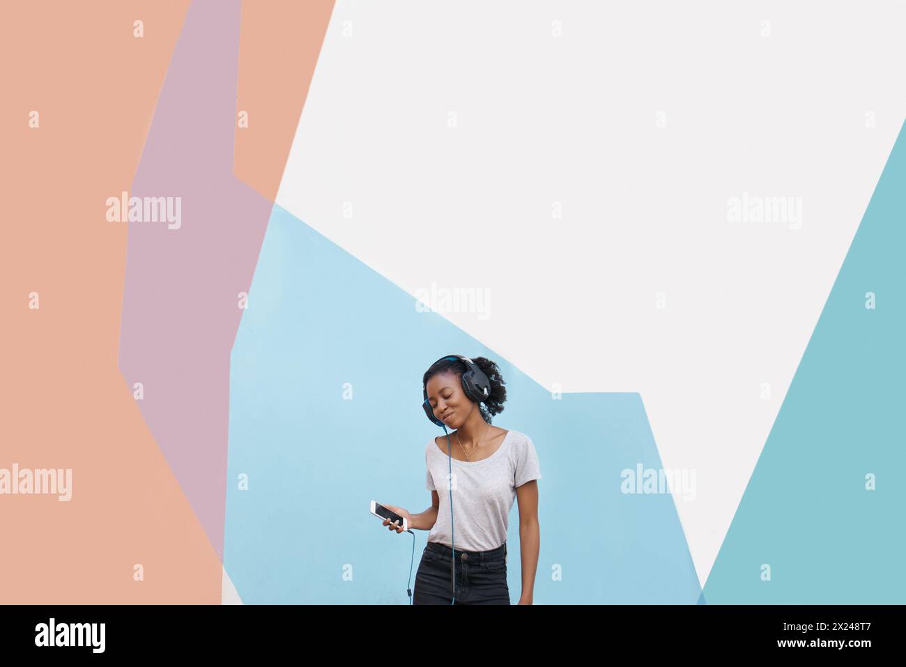 Girl, headphones and phone for streaming in studio, website and online ...