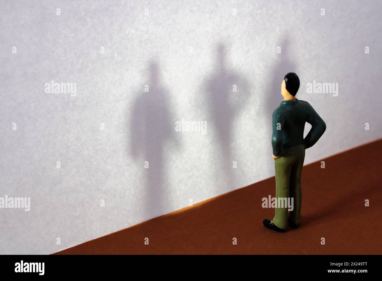 Person observing three silhouettes projected on the wall Stock Photo ...