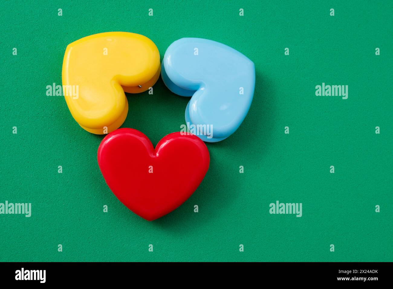 Heart shaped clips of different colors Stock Photo - Alamy