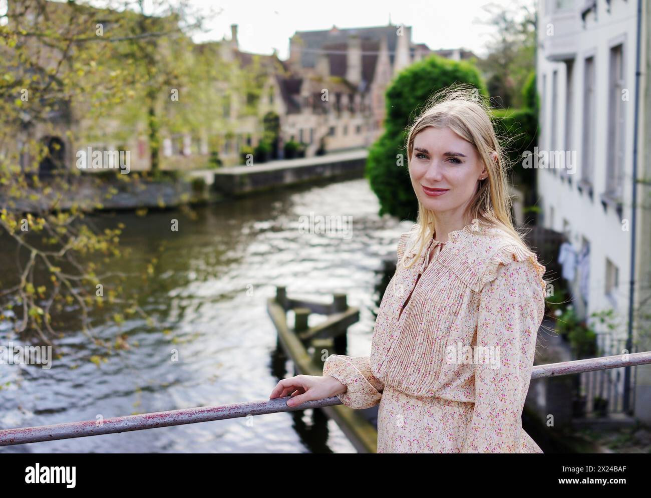 beautiful girl in a dress walks in Bruges Belgium Stock Photo - Alamy