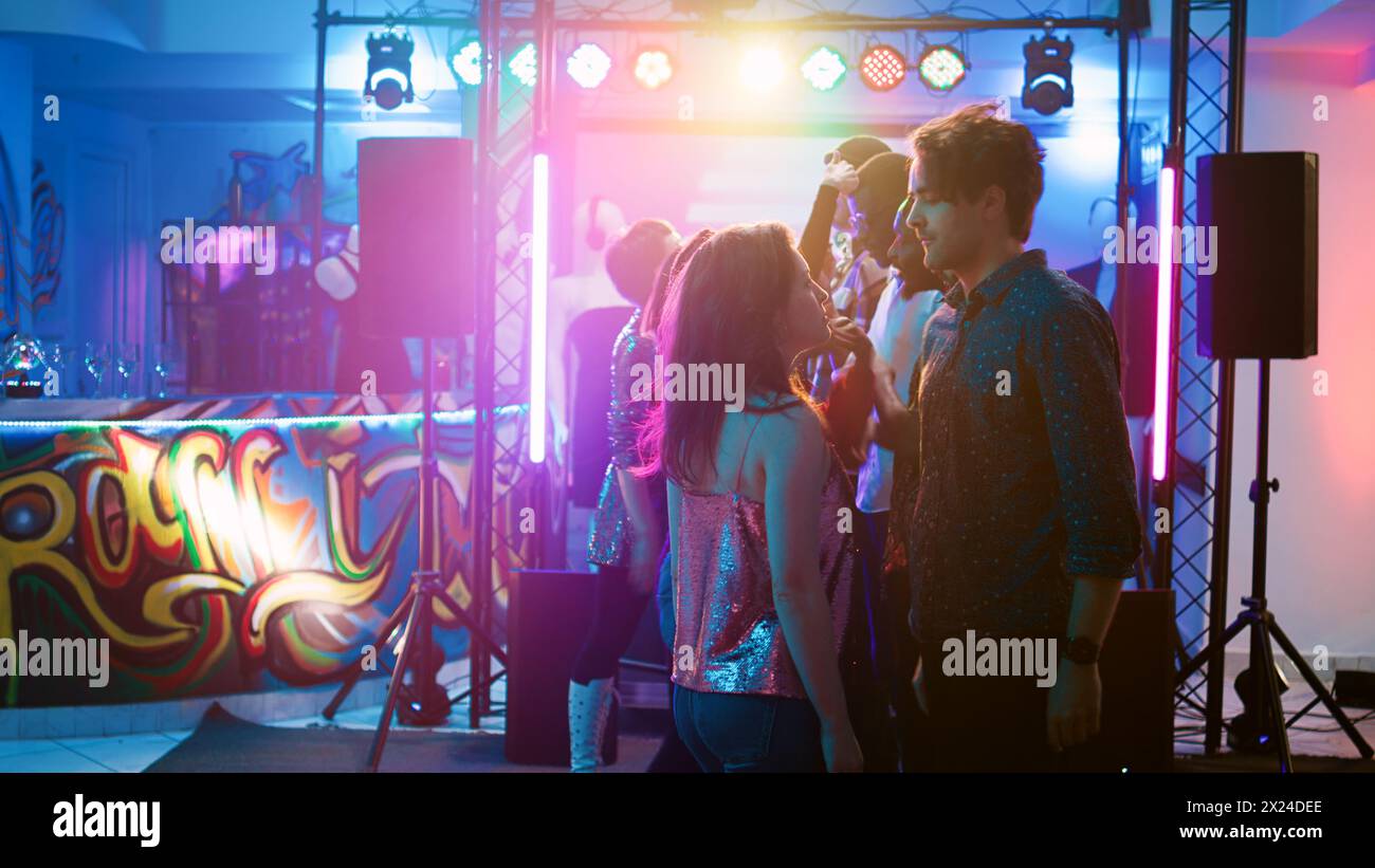 Men and women dancing at funky party with electronic music, having fun ...